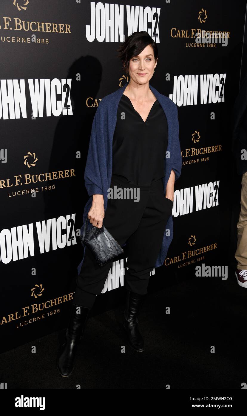 Actress Carrie Ann Moss Poses At The Premiere Of The Film John Wick