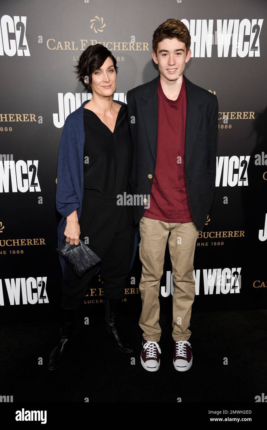 Actress Carrie-Ann Moss poses with her son Owen at the premiere of the ...