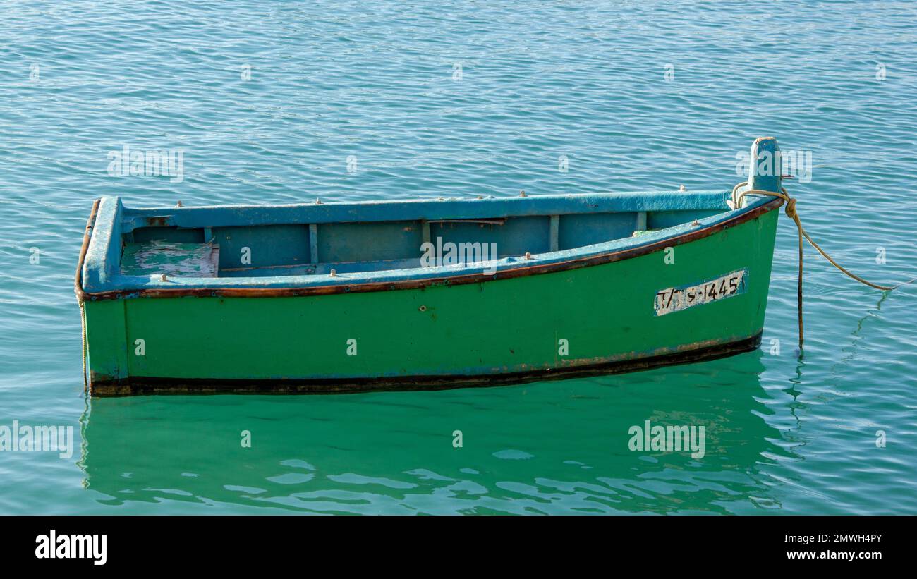 A closeup of green boat in water Stock Photo - Alamy