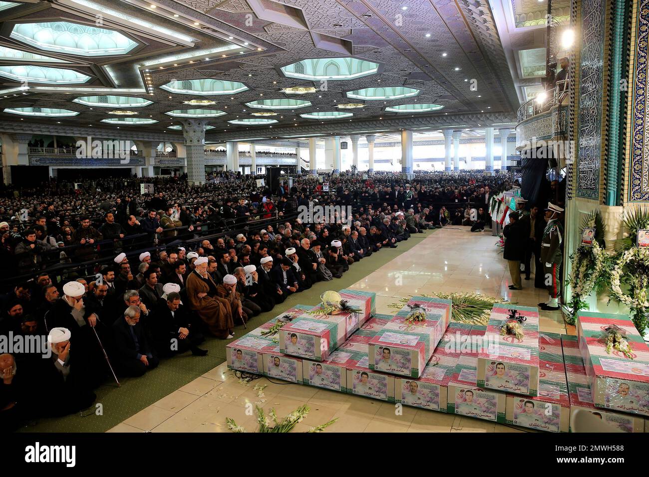 The flag draped coffins of 16 firefighters killed in the collapse of a ...