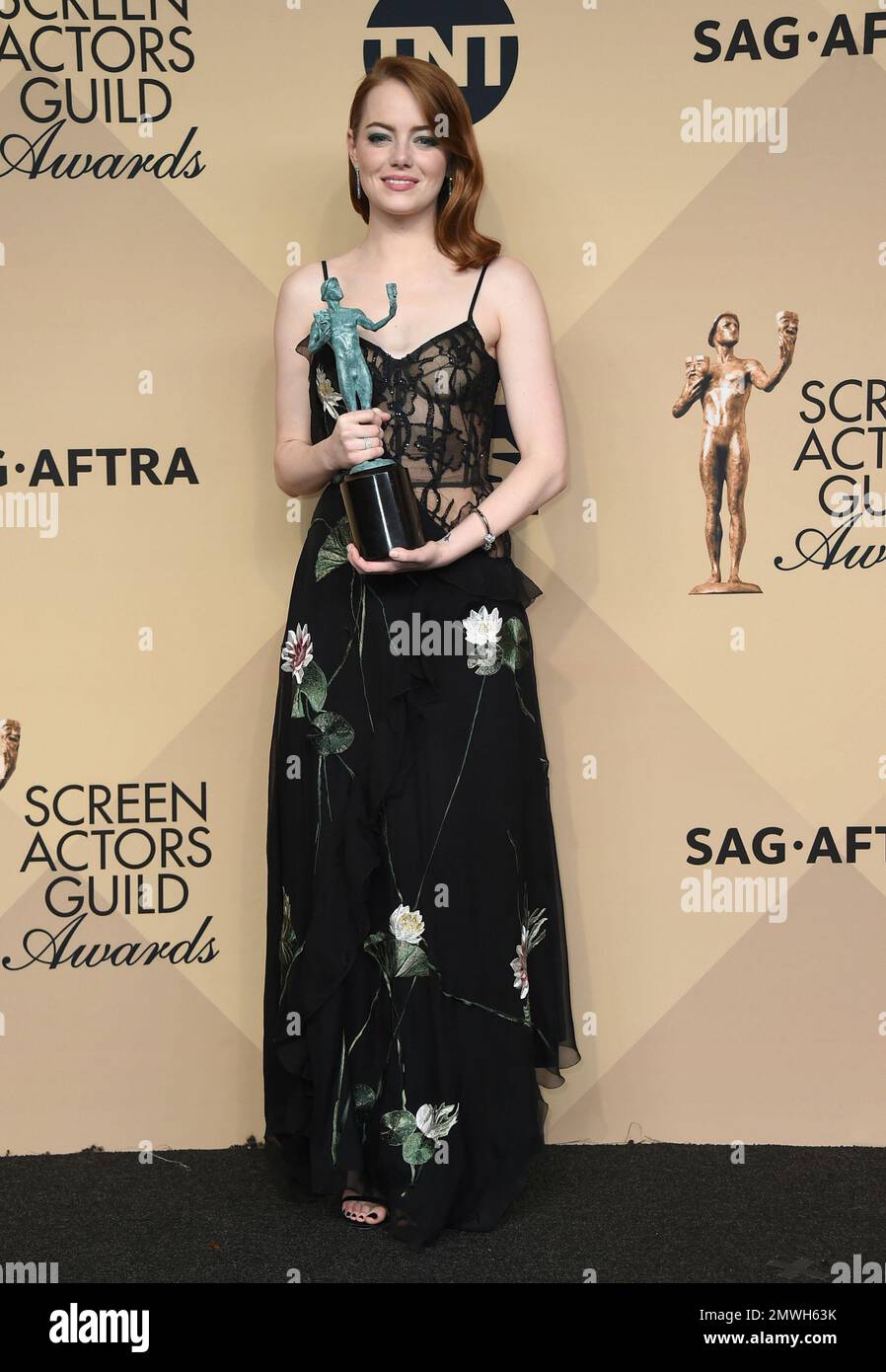 Emma Stone Poses In The Press Room With The Award For Outstanding