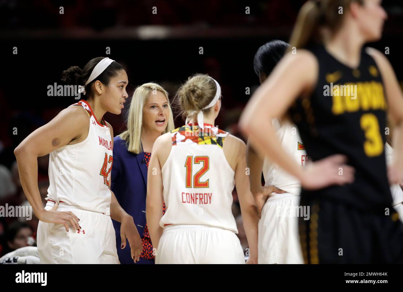 Maryland head coach Brenda Frese, second from left, huddles with ...
