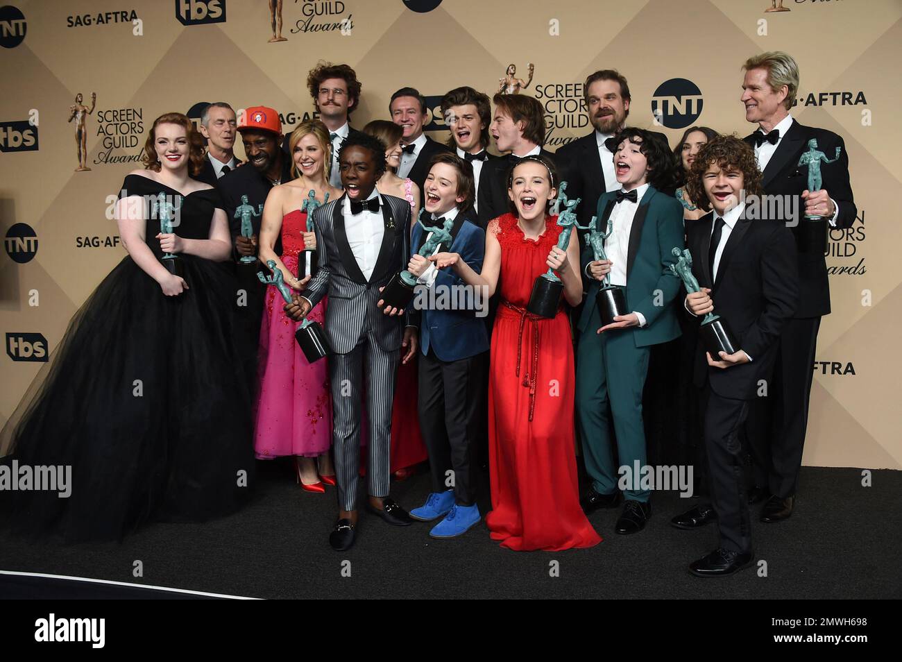 The cast and crew of "Stranger Things" pose in the press room with the ...