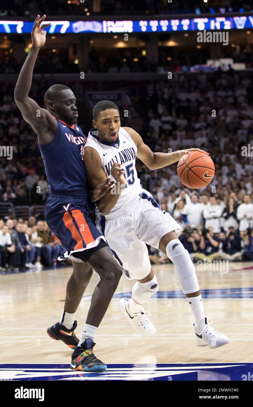 Villanova's Mikal Bridges, right drives to the basket against Virginia ...