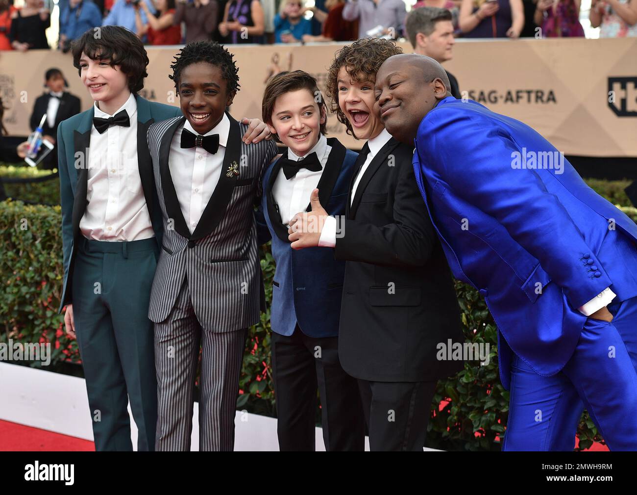 Finn Wolfhard, from left, Caleb McLaughlin, Noah Schnapp, Gaten Matarazzo, and Tituss Burgess ...