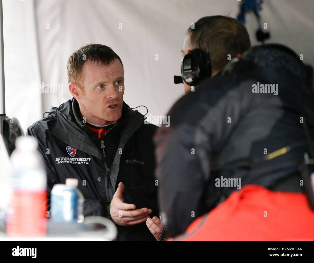 Robin Liddell, left, of Great Britain, talks with crew members in his ...