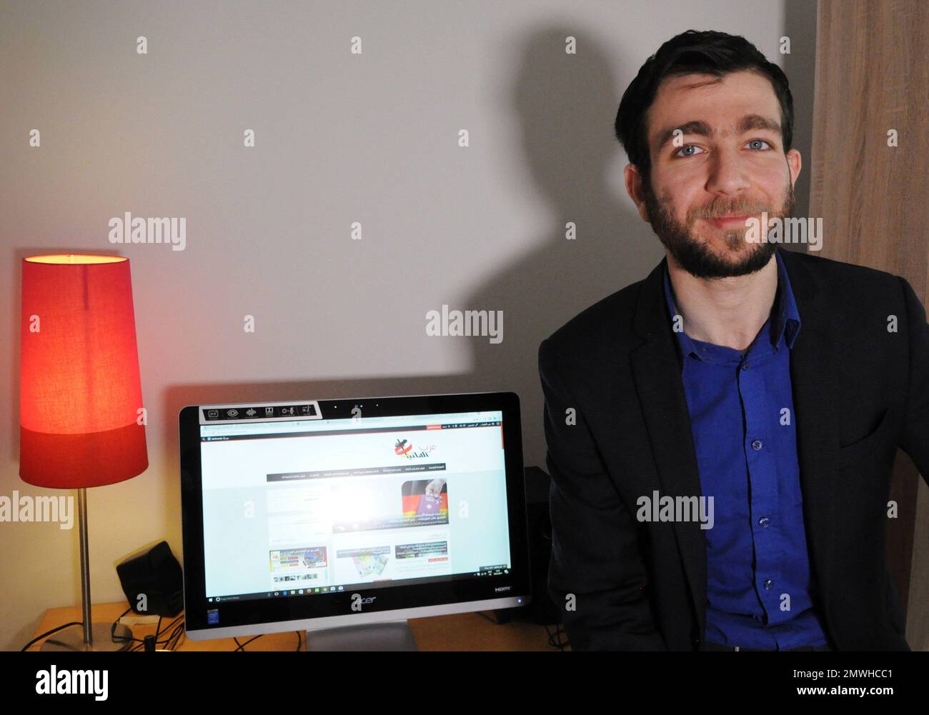 In this Jan. 19, 2017 photo 28-year-old Talal Mando poses in front of a screen with his website ...