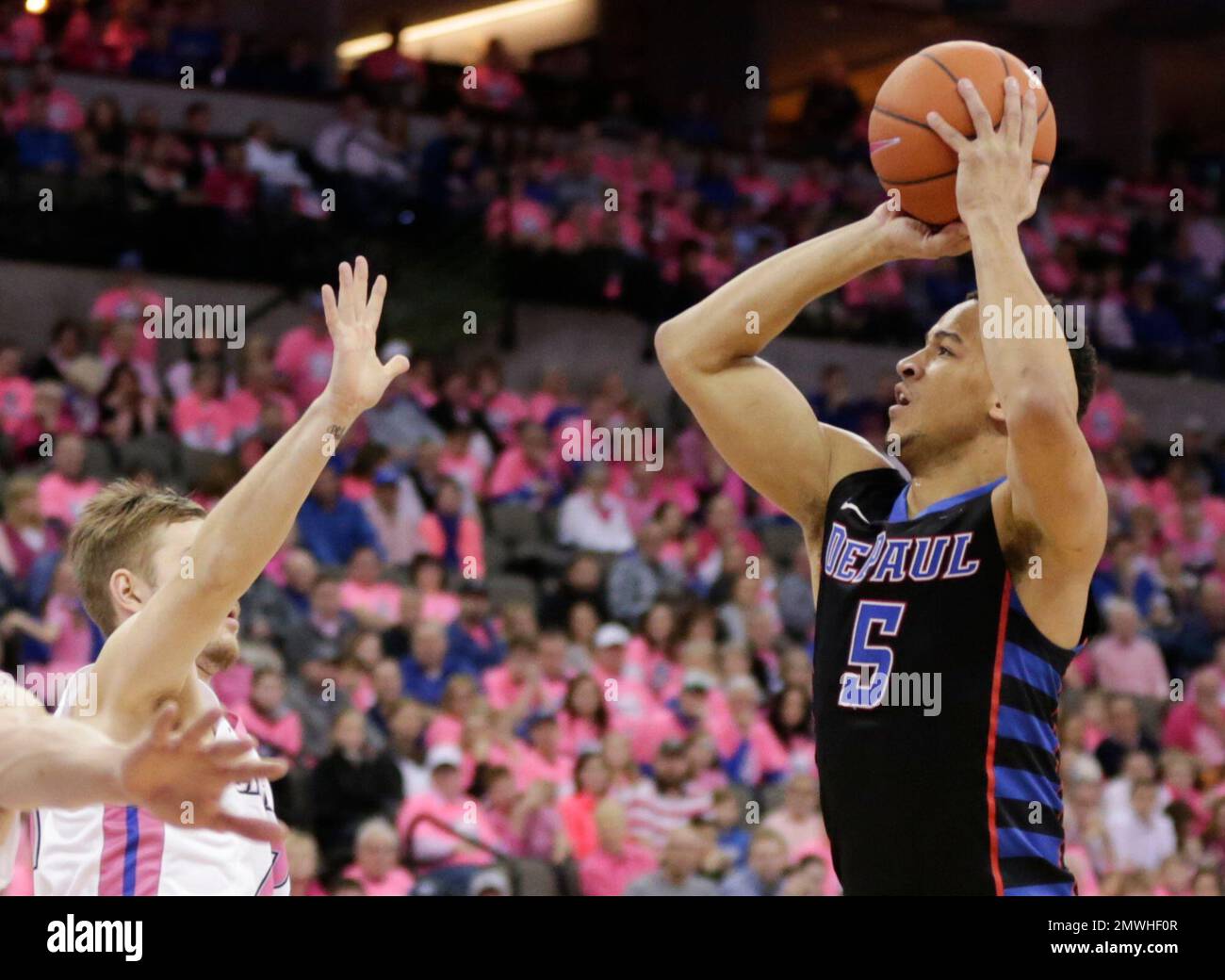 DePaul's Billy Garrett Jr. (5) shoots over Creighton's Isaiah Zierden ...
