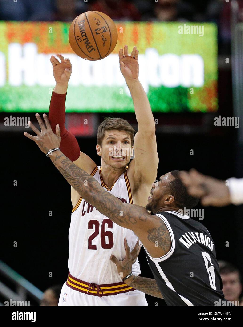 Cleveland Cavaliers' Kyle Korver (26) passes over Brooklyn Nets' Sean ...