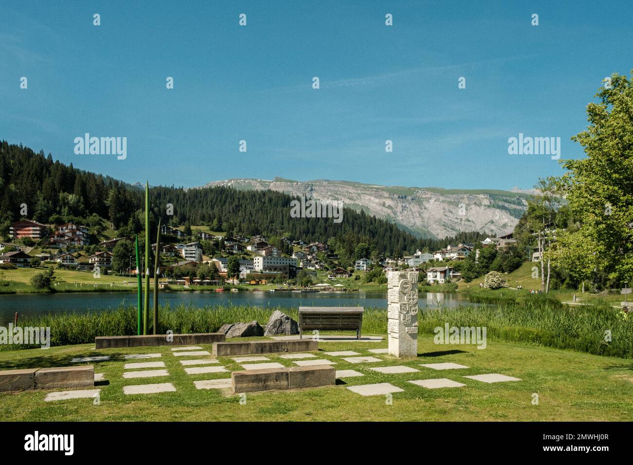 An aerial view of Laax town surrounded by buildings and dense trees ...