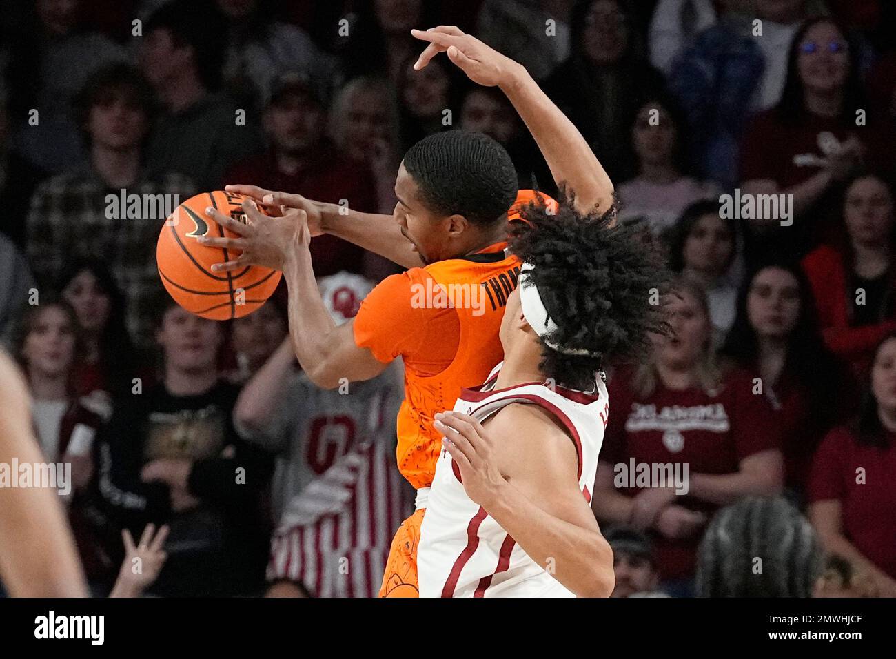 Oklahoma State guard Bryce Thompson, left, grabs a rebound in front of ...