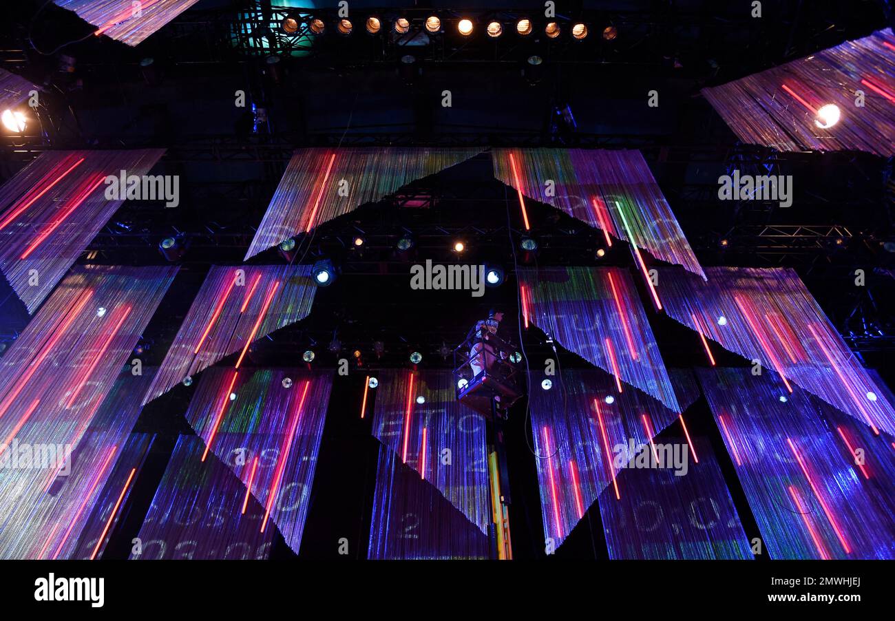 A crew member works on the stage backdrop for Sunday's Screen Actors ...