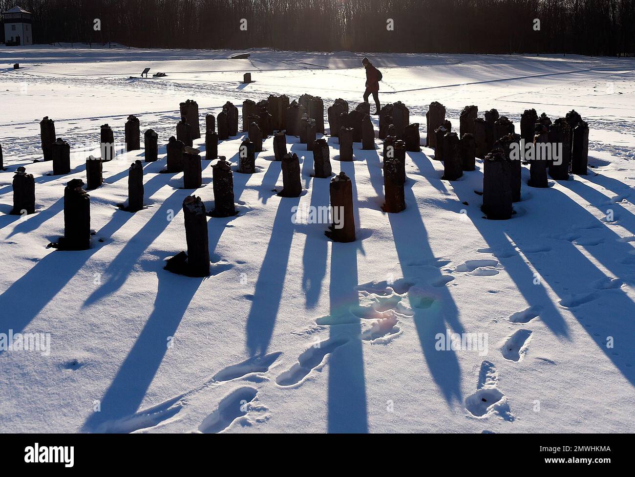 Memorial stones standing for all Nazi concentration camps throw shadows ...
