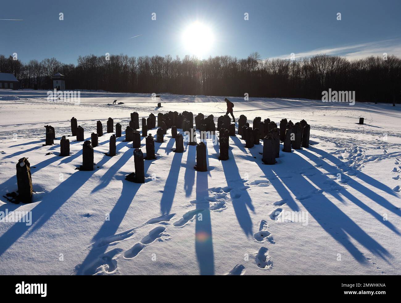Memorial stones standing for all Nazi concentration camps throw shadows ...