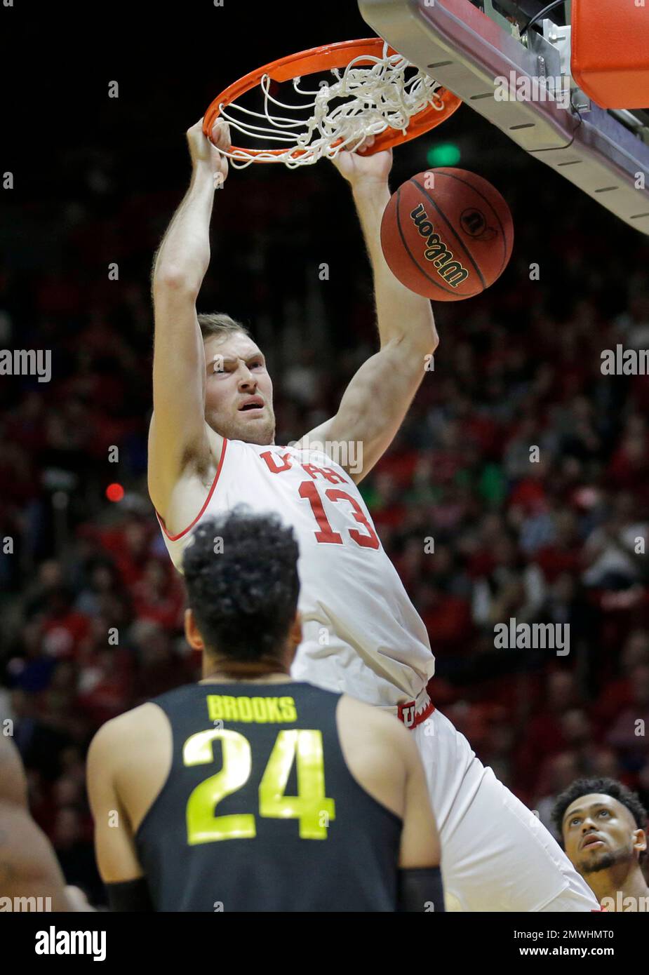 Utah forward David Collette (13) dunks as Oregon forward Dillon Brooks ...
