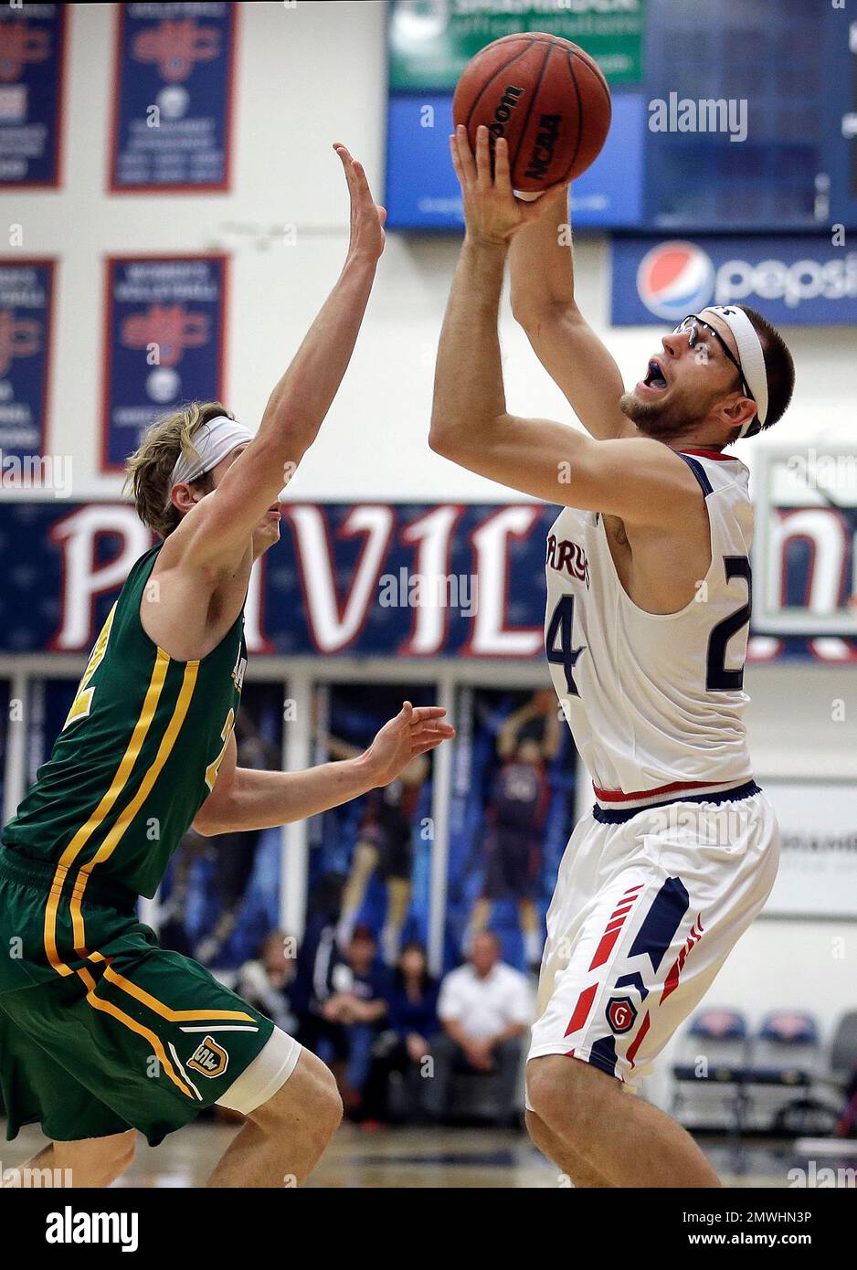 Saint Mary's Calvin Hermanson, right, looks to pass away from San ...