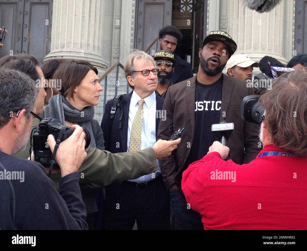 Robert Jones, right, speaks with reporters, with defense attorneys ...