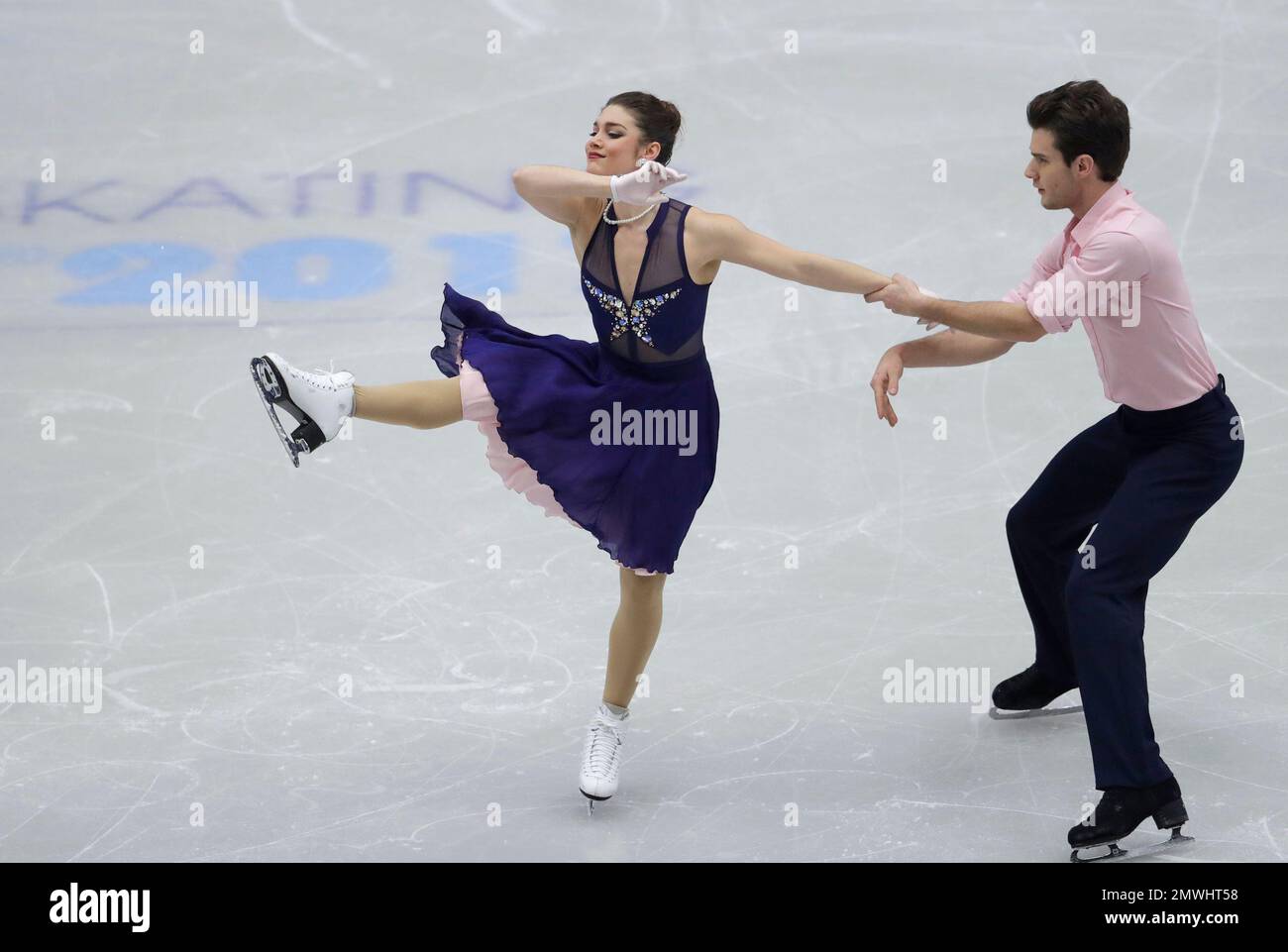 Laurence Fournier Beaudry and Nikolaj Sorensen, of Denmark, skate their ...