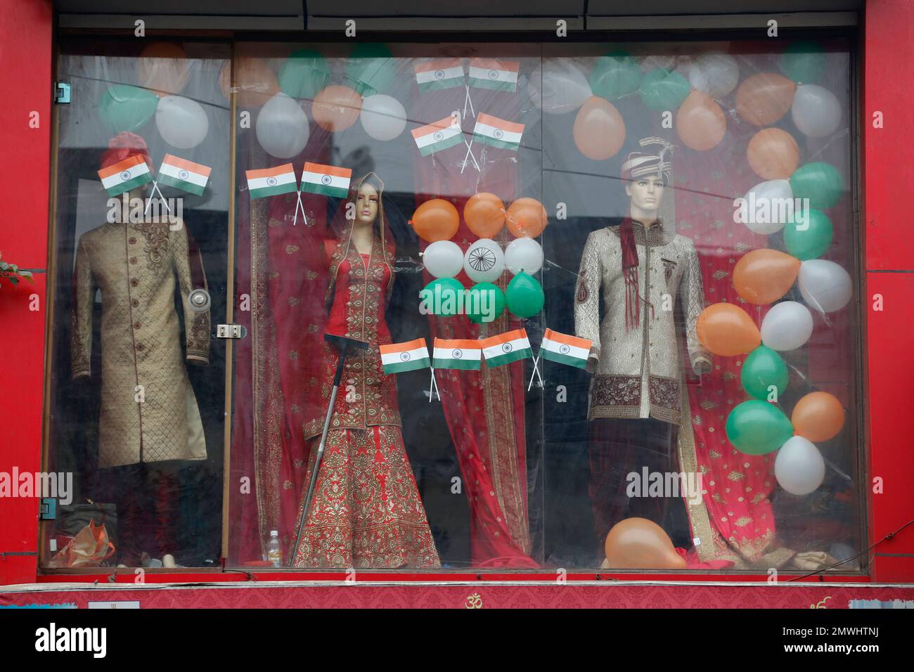 The display window of a shop is decorated with Indian flags and ...