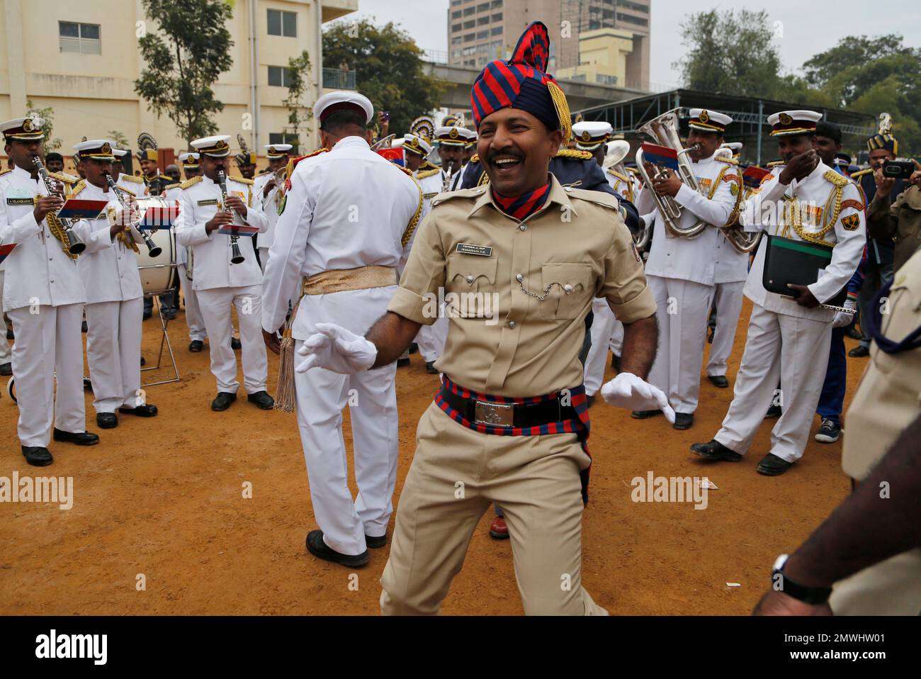 A policeman dances to music played by a police band before ...