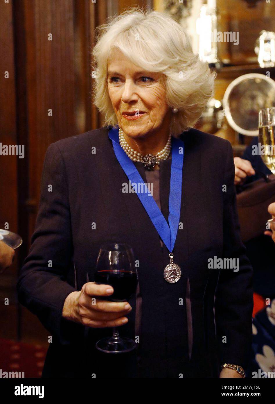 Britain's Camilla, The Duchess of Cornwall holds a glass of wine after ...