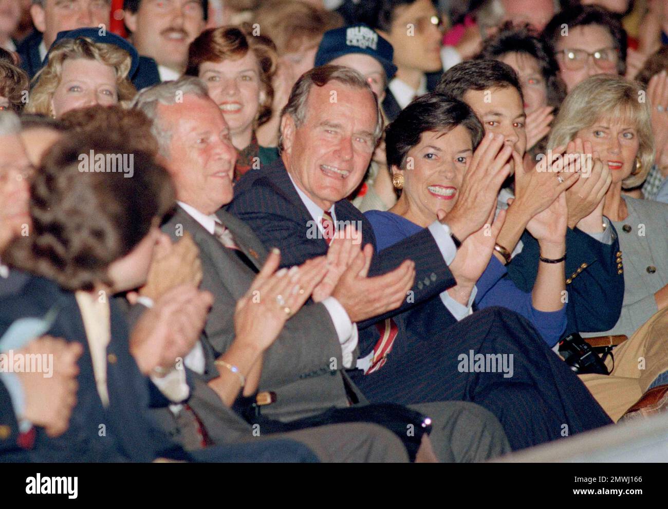 President George Bush applauds one of the country music acts that ...