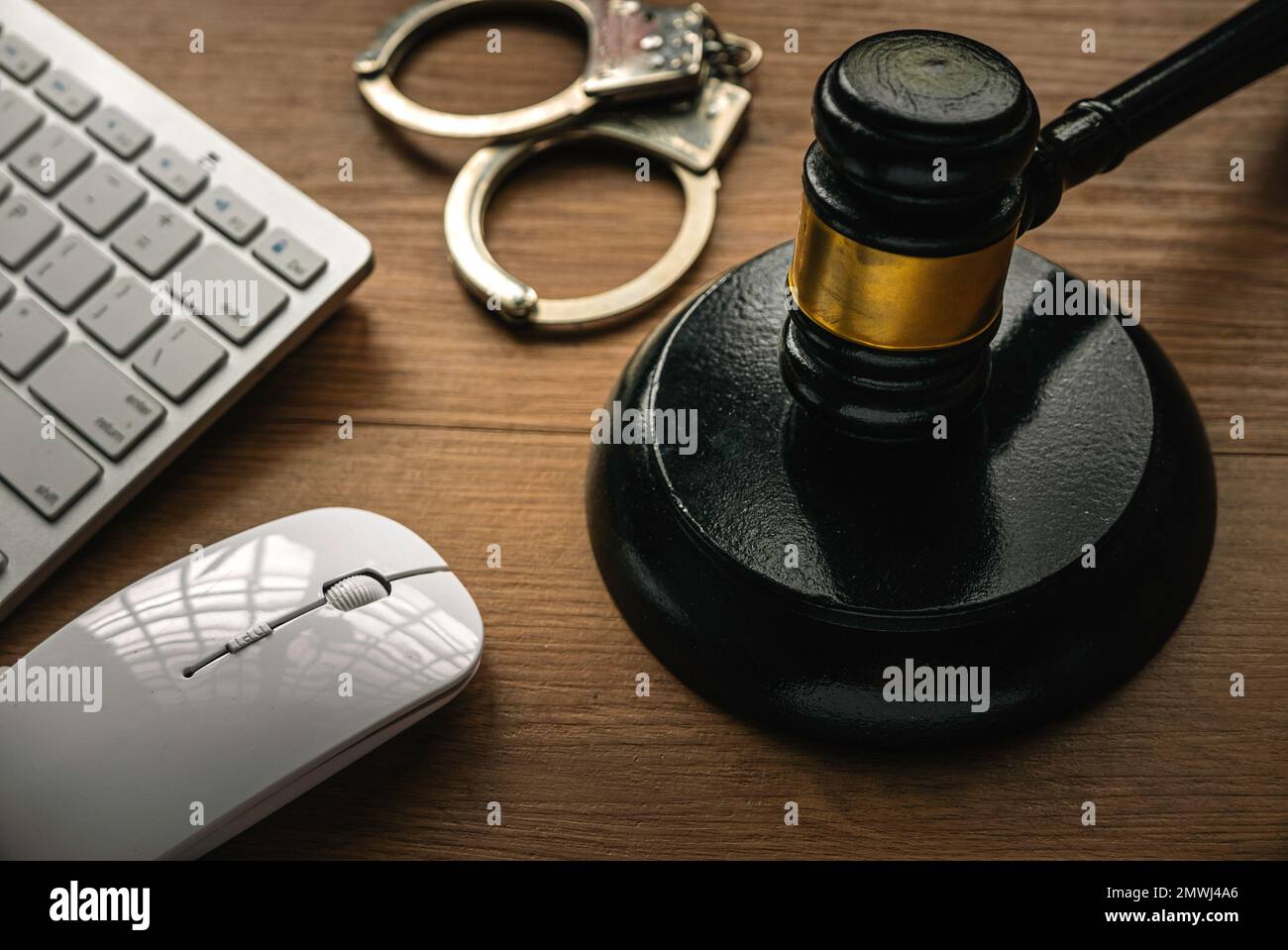 Concept of internet crime with gavel, computer keyboard, mouse and ...