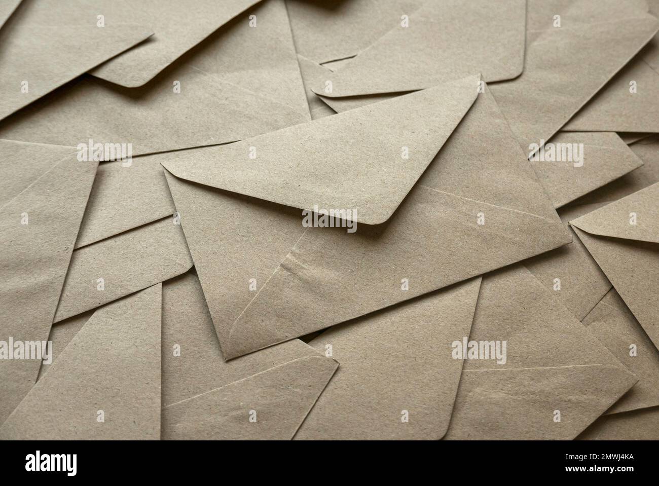 A stack of brown craft envelopes for background Stock Photo - Alamy