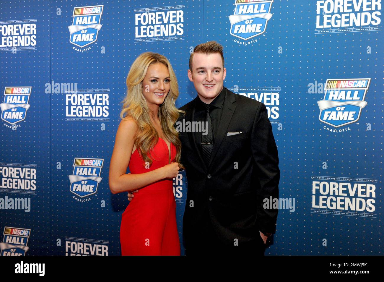 Ty Dillon and wife, Haley, pose for photographers on the red carpet ...