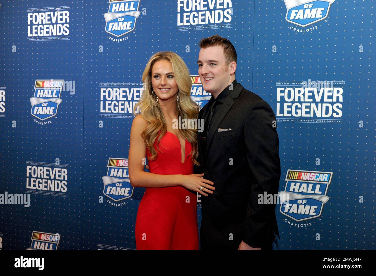 Ty Dillon and wife, Haley, pose for photographers on the red carpet ...