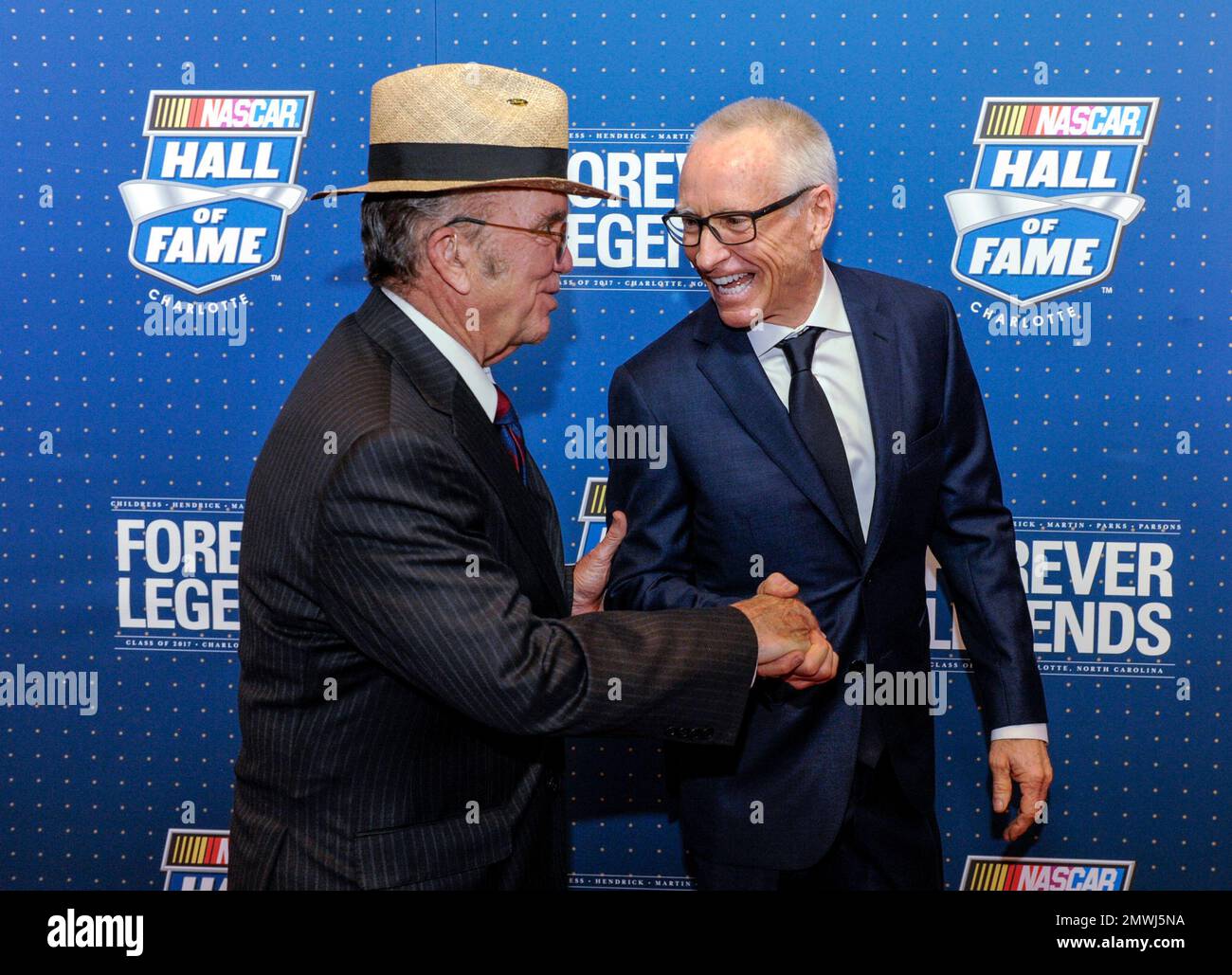 Jack Roush, left, shakes hands with former driver Mark Martin on the ...