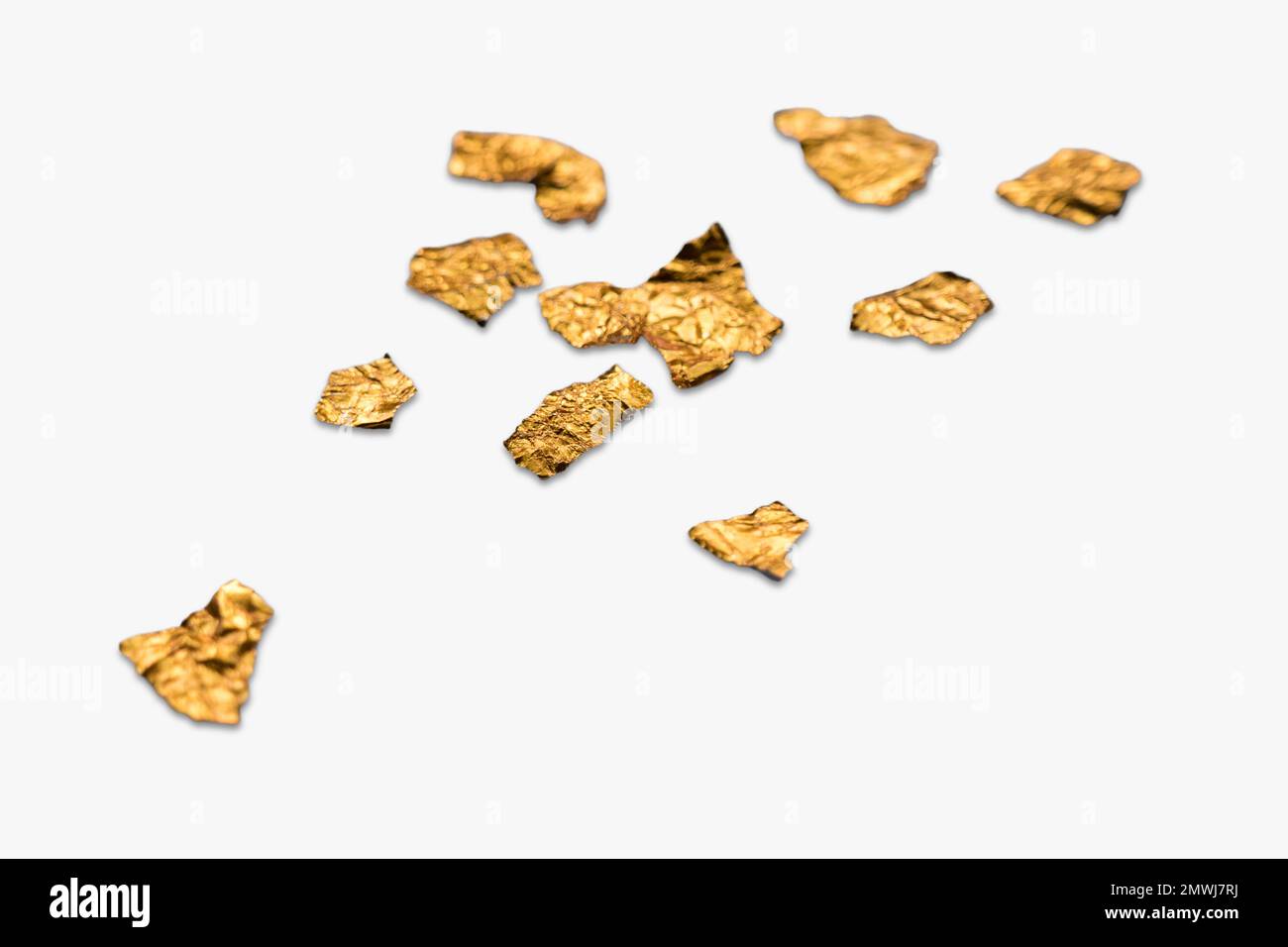 Shiny pieces of crumpled and creased gold foil or leaf isolated on a ...