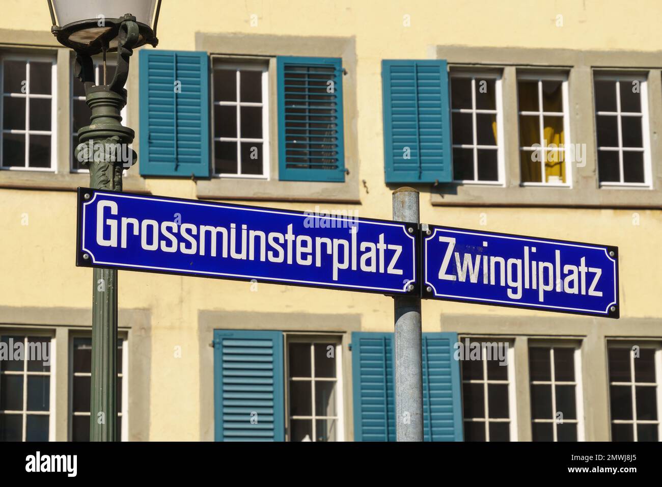 Blue street sign in Zurich, Switzerland for Grossmunsterplatz. With ...