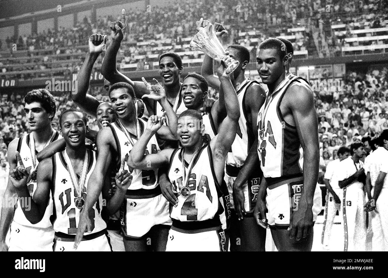 U.S. team captain Tyrone Bogues (4) and teammates celebrate their 87-85 ...