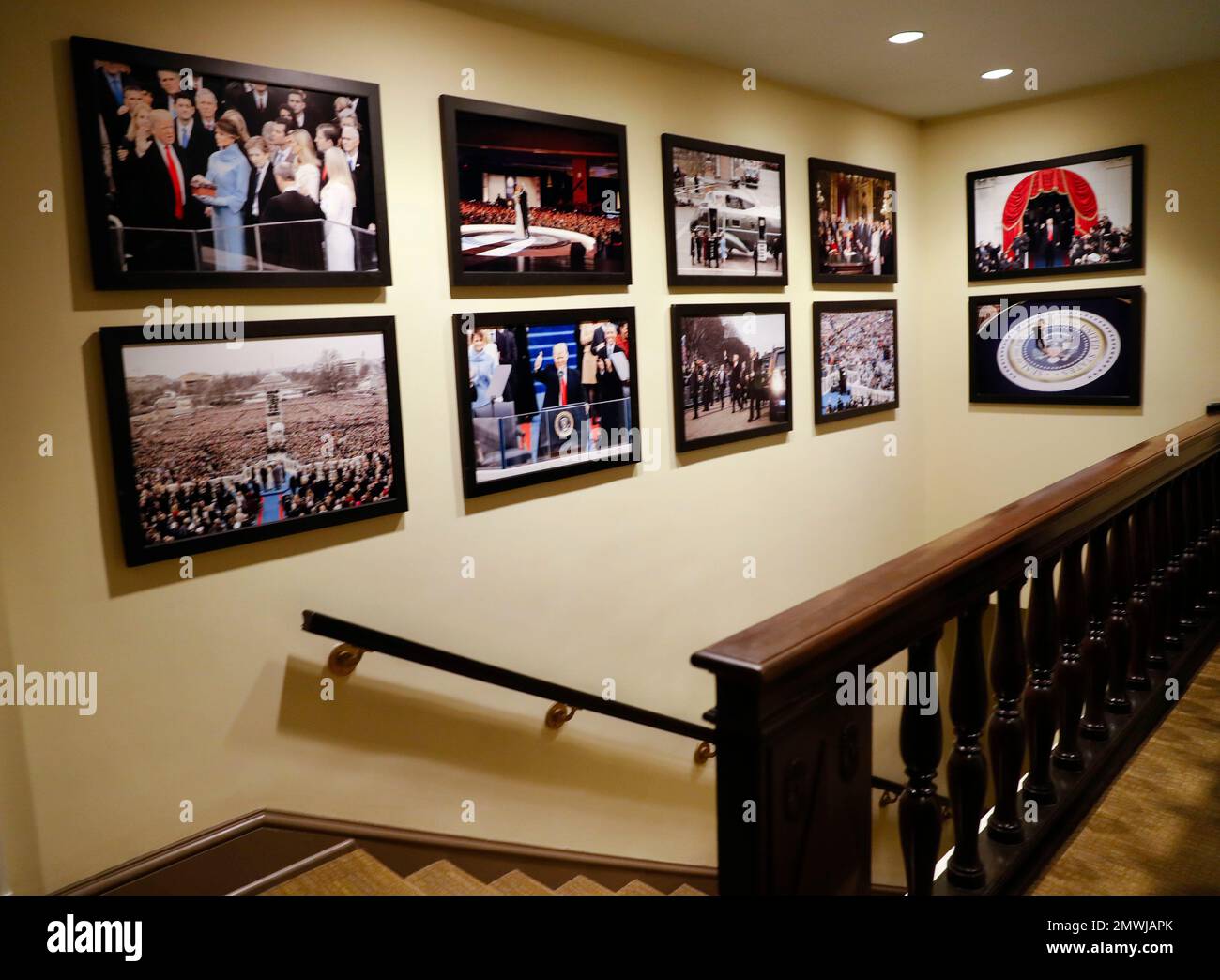 Photos of President Donald Trump's inauguration are hung on the walls ...