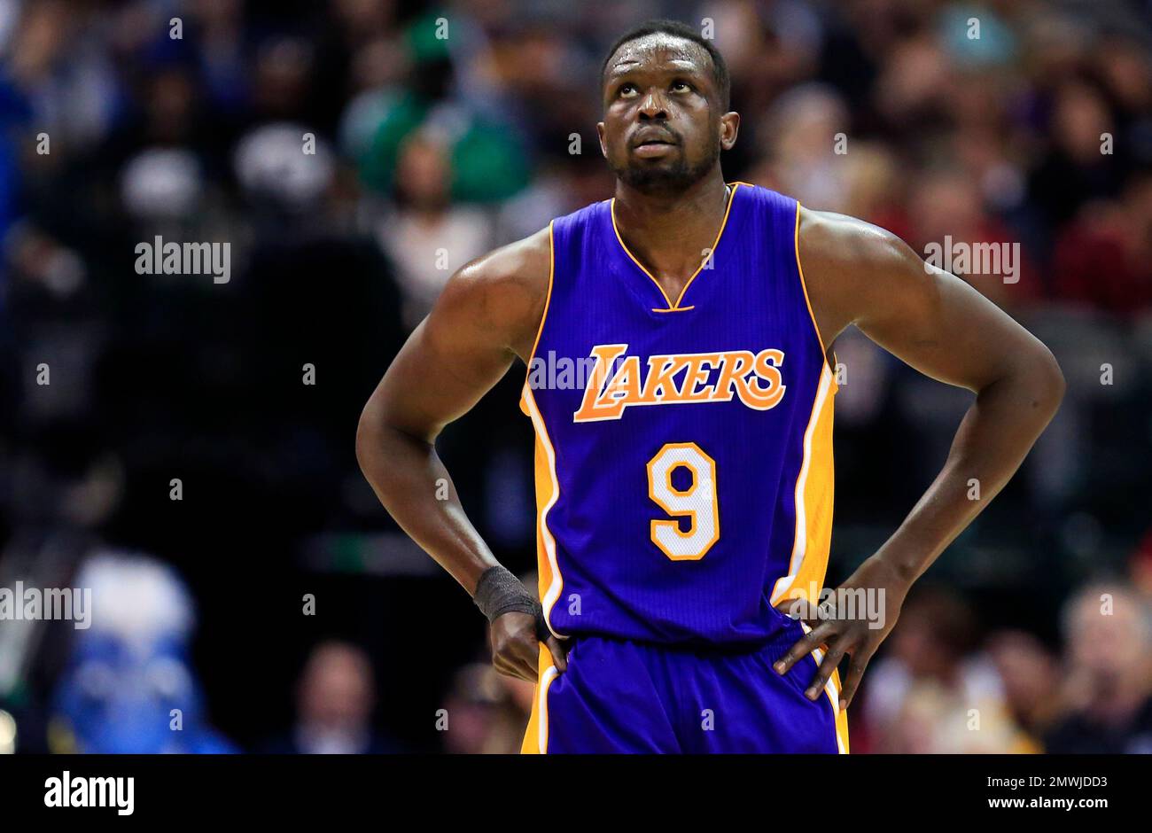 Los Angeles Lakers forward Luol Deng (9) walks toward the bench during ...