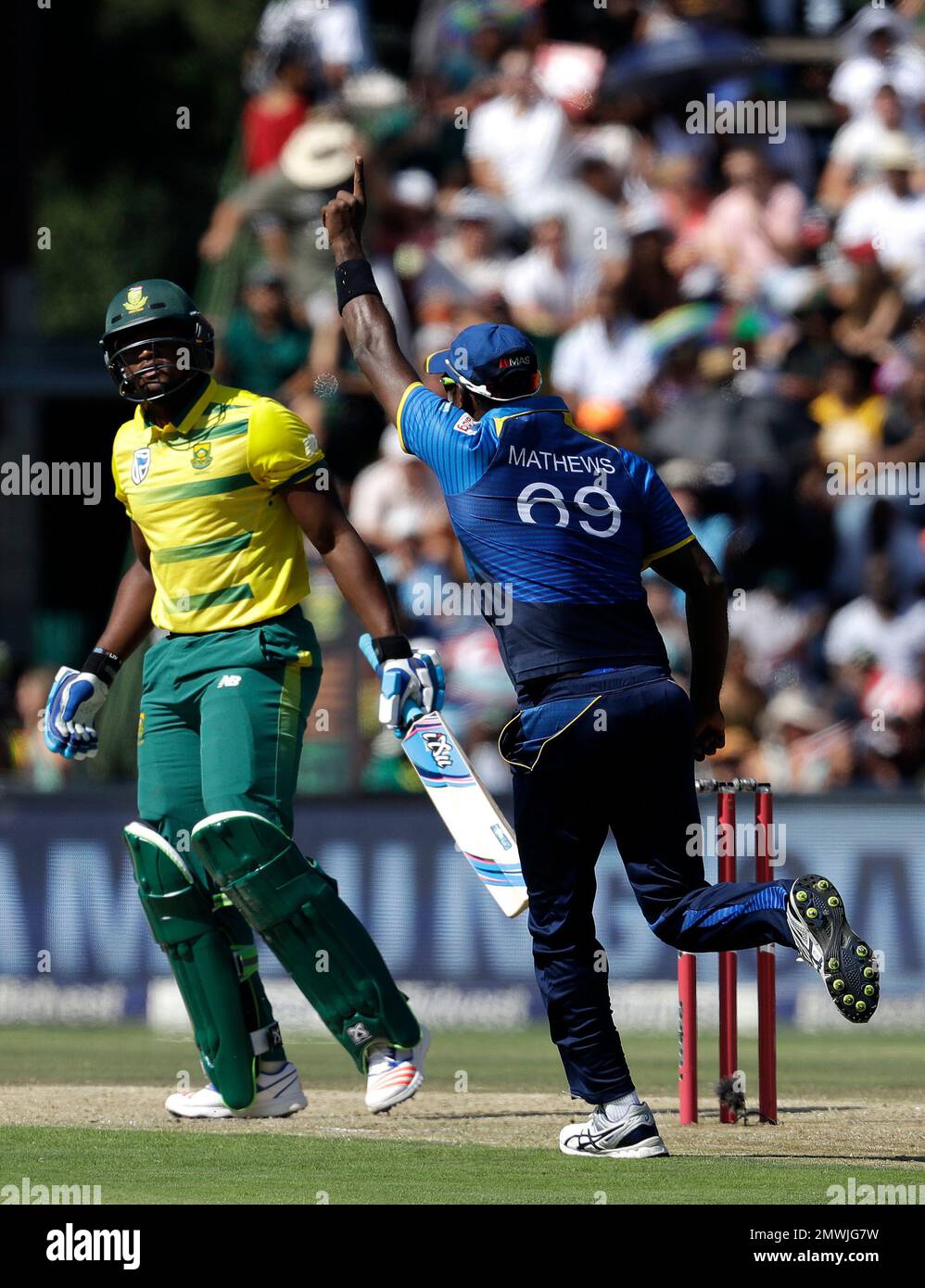 South Africa's batsman Andile Phehlukwayo, left, looks on as Sri Lanka ...