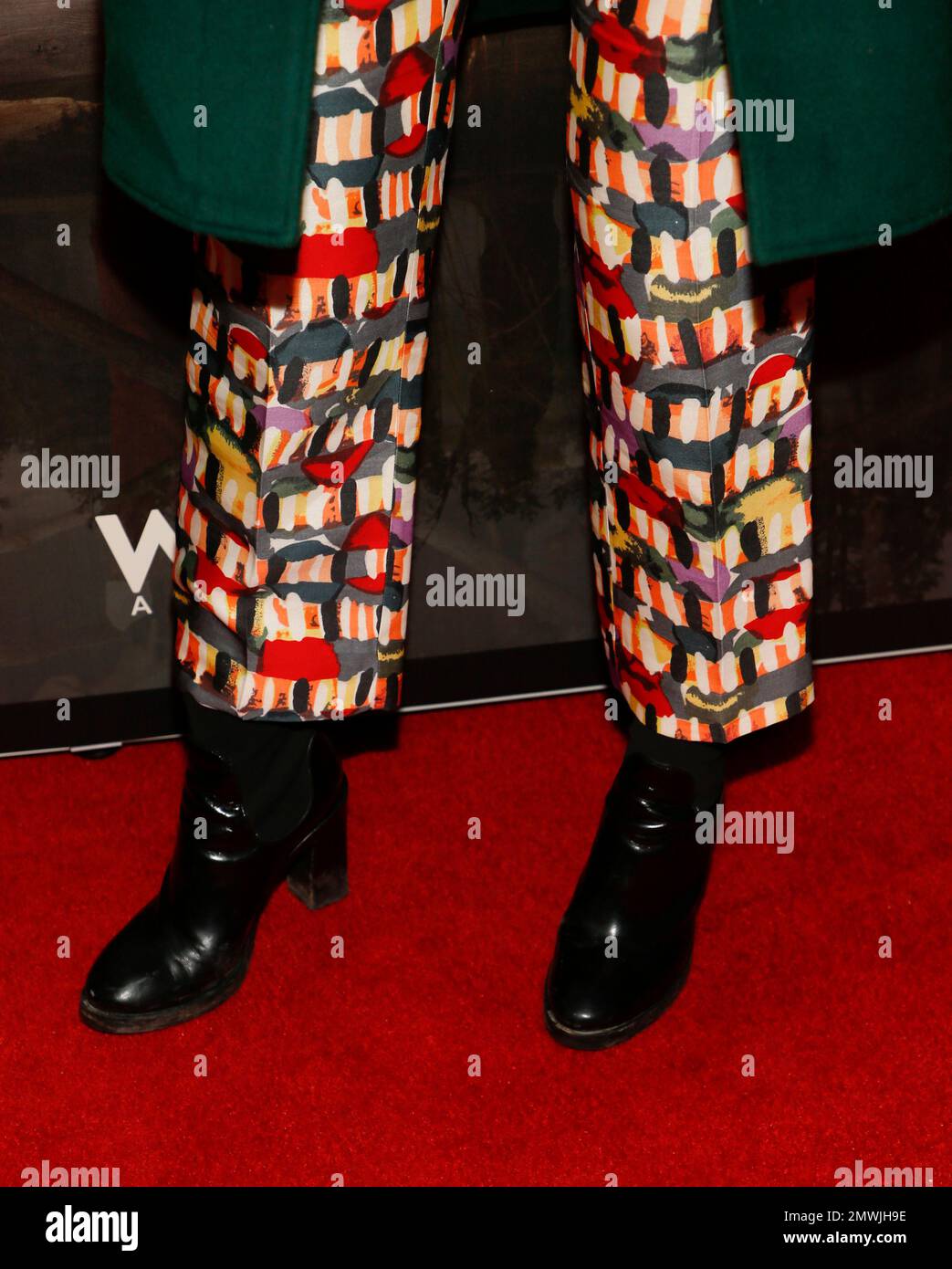 The shoes and pants worn by actress Medalion Rahimi are seen as she ...