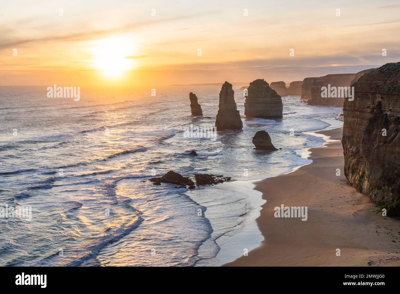 A view of the sunset from the rocky beach in Victoria, Australia Stock ...