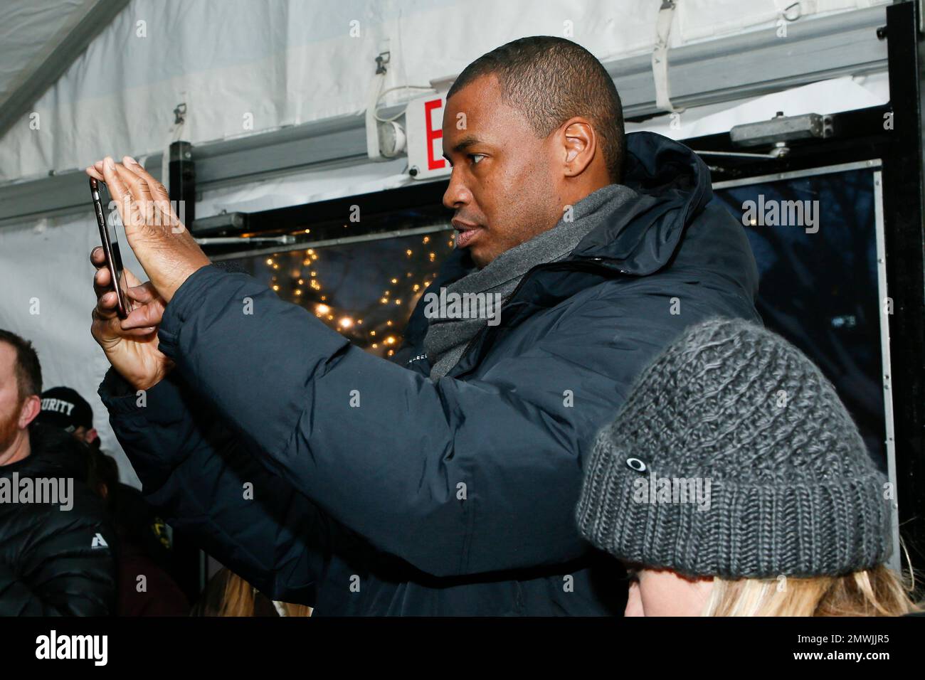 Former NBA basketball player Jason Collins takes a photo as his ...