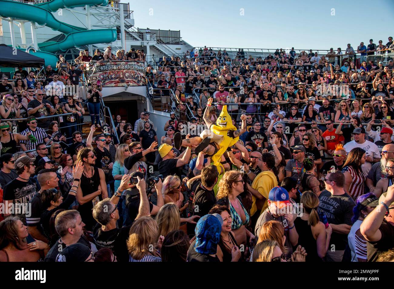 A fan goer crowd surfs as Wilson performs on board the Carnival Victory ...