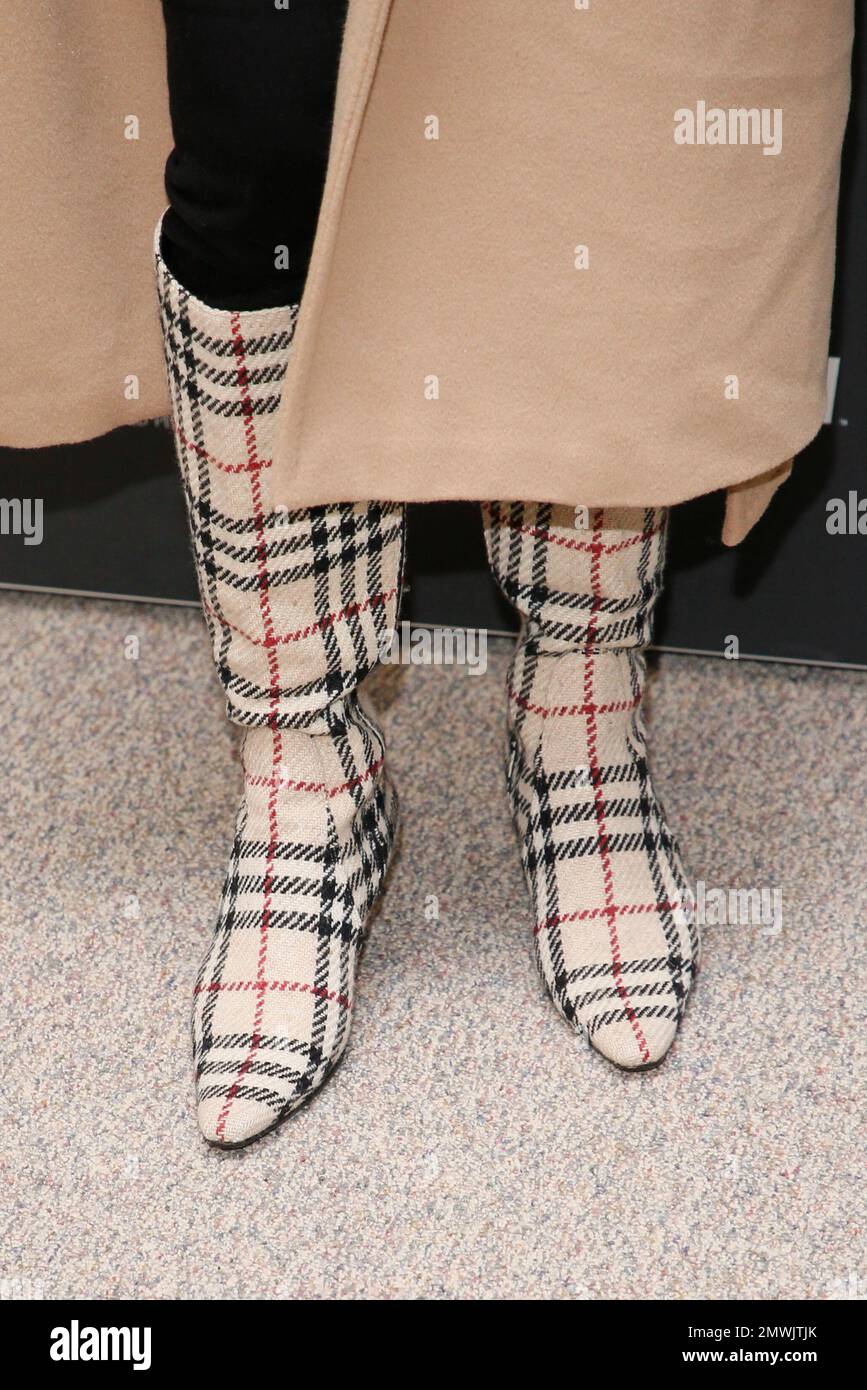 The boots worn by actress Laura Dern are seen as she poses at the ...