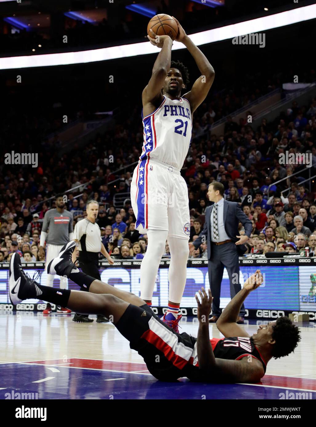 Philadelphia 76ers' Joel Embiid (21) goes up for a shot over Portland Trail Blazers' Ed Davis ...