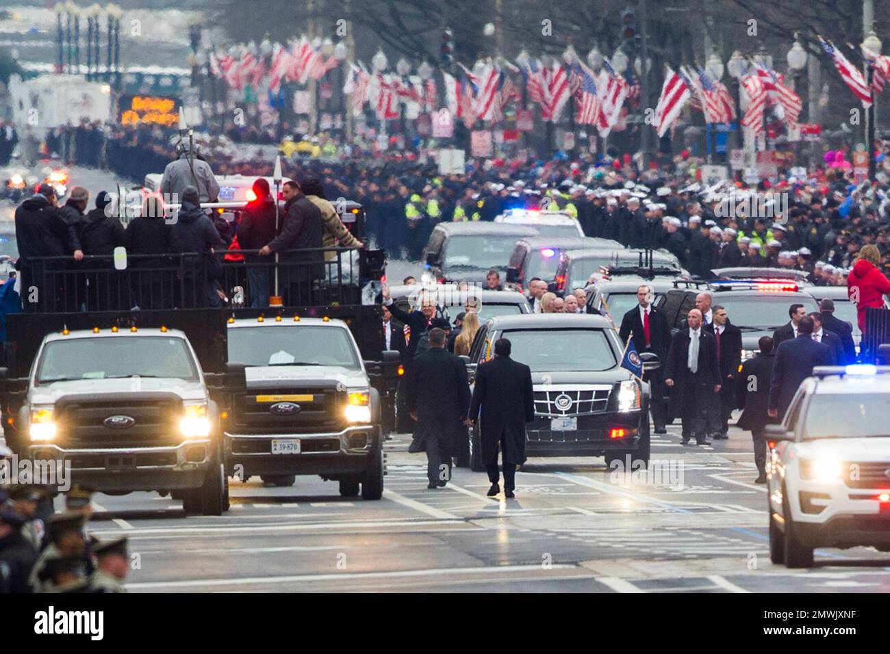 President Donald Trump and his wife Melania, center, walk during the ...