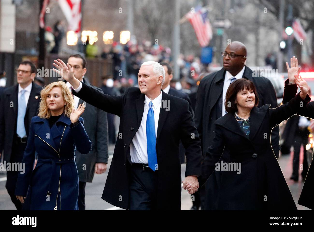 Vice President Mike Pence walks in the inauguration parade in Washington, Friday, Jan. 20, 2017 ...