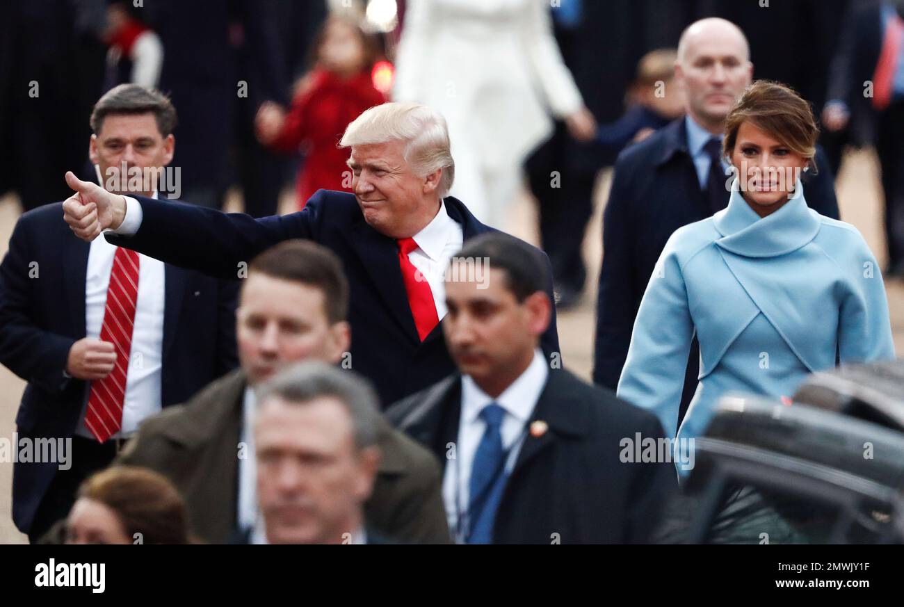 President Donald Trump and first lady Melania Trump walk alone the ...