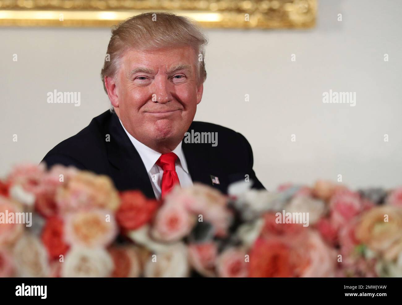 President Donald Trump smiles during the inaugural luncheon at the ...