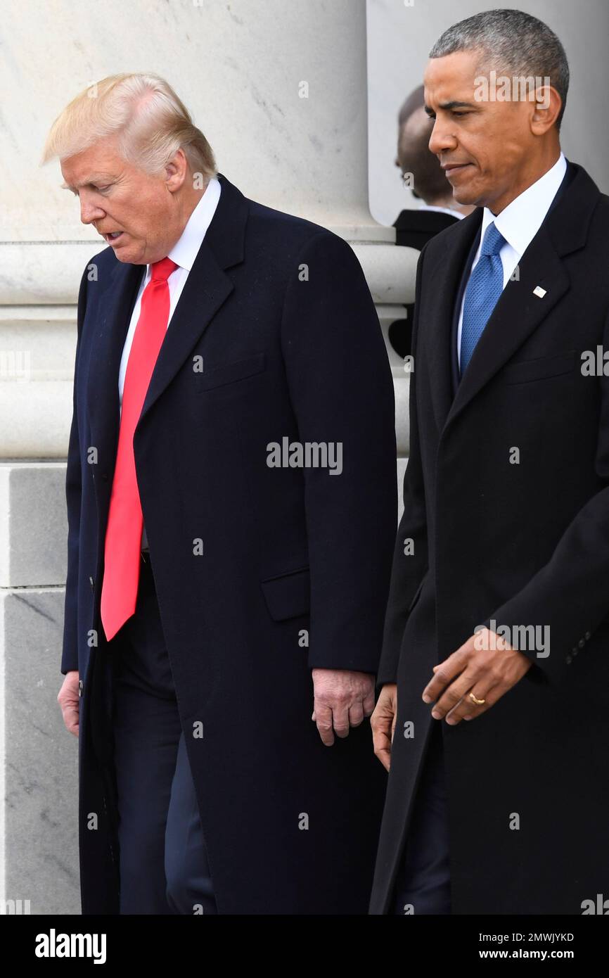 President Donald Trump and former President Barack Obama walk out of ...
