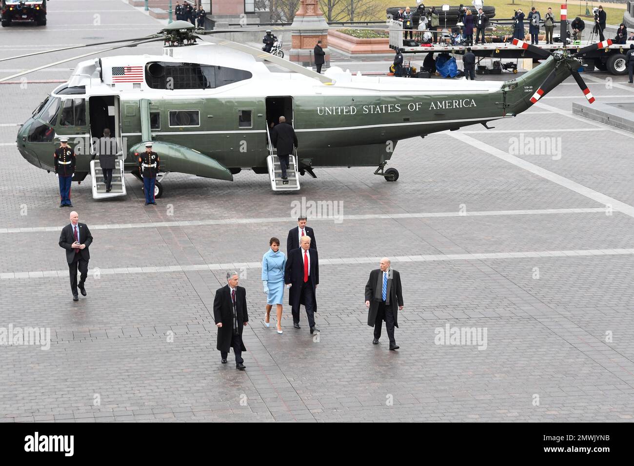 President Donald Trump and Melania Trump walk back after escorting ...