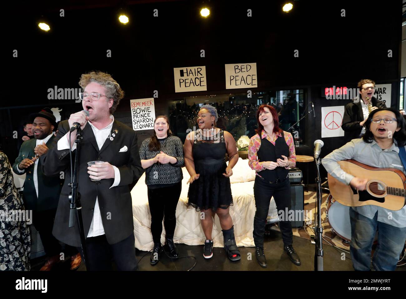 Performers sing "Give Peach a Chance" during a "bed-in" at local radio ...